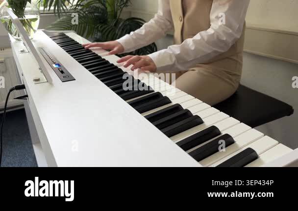 Close Up of Female Hands Performing Piano Music in Bright Modern ...
