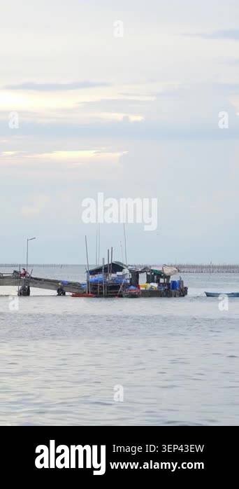 Scenic coastal harbor in cloudy evening light , Local fishing community ...