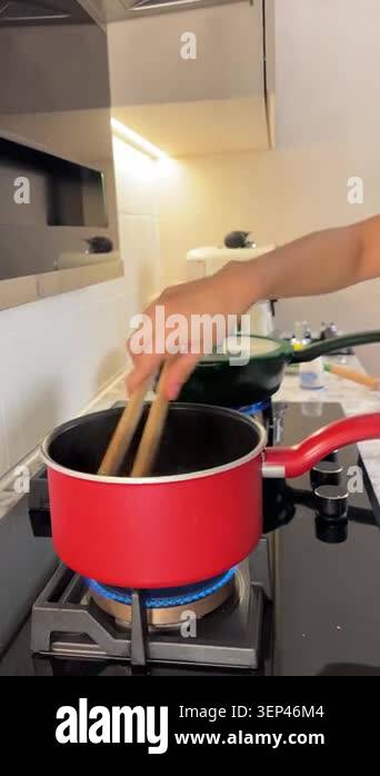 Asian female influencer cooking vlog video using smartphone spaghetti ...