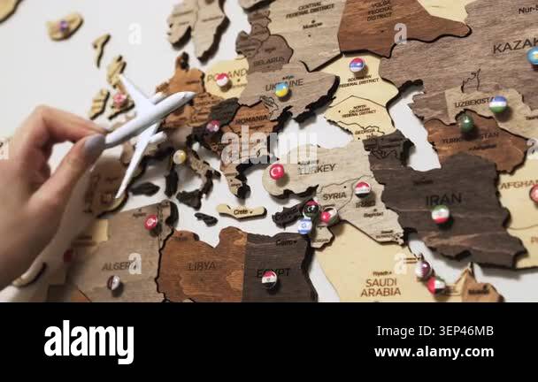 Woman holding airplane above wooden map, travel concept Stock Video ...