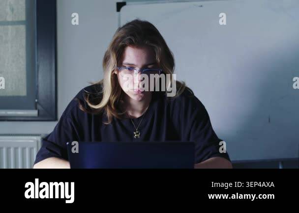 Young girl studies and Works on computer Laptop and surfs the internet ...