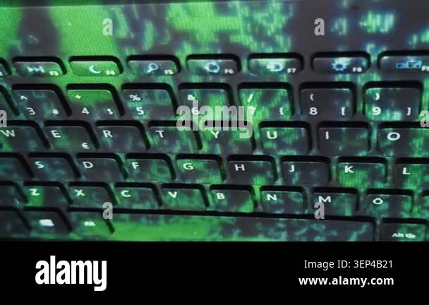 Matrix hacker style green data streams projected onto a computer ...