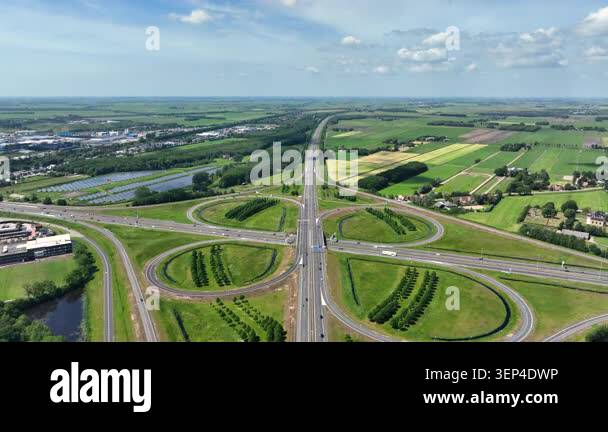 Aerial view of a large highway cloverleaf junction near Heerenveen in ...