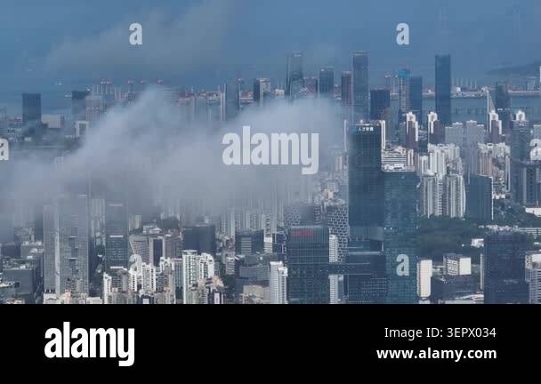 Aerial view of a dense cityscape with numerous skyscrapers partially ...