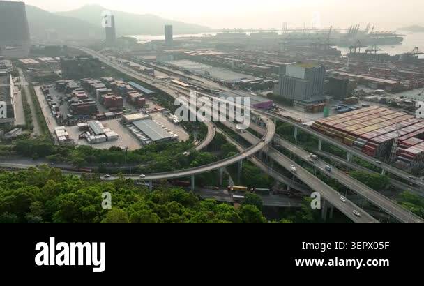 Aerial drone footage of a busy highway interchange and a large ...