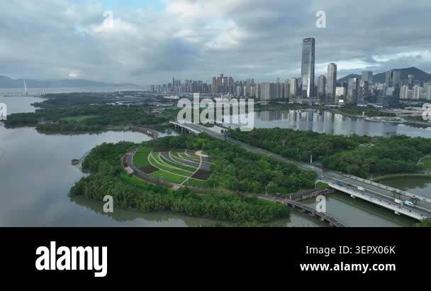 Aerial drone footage of a modern city skyline with skyscrapers and a ...