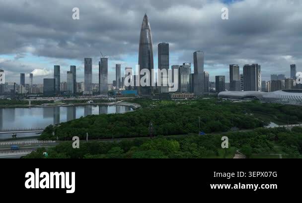 Aerial drone footage of a modern city skyline with tall skyscrapers and ...