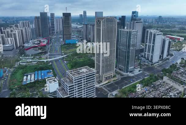 Aerial drone footage capturing a modern cityscape with numerous ...