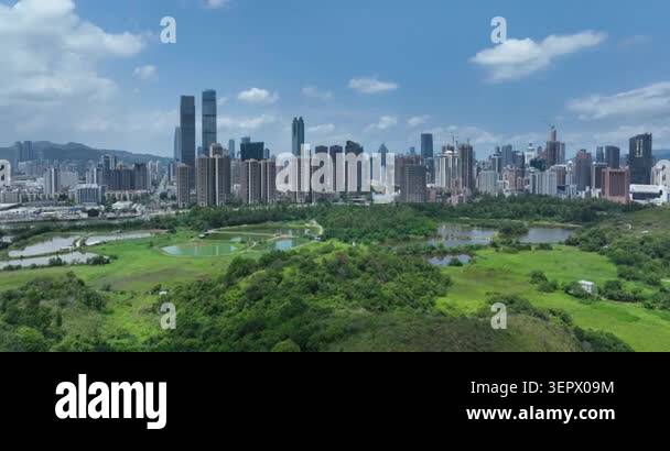 Aerial drone view of a sprawling cityscape with modern skyscrapers and ...