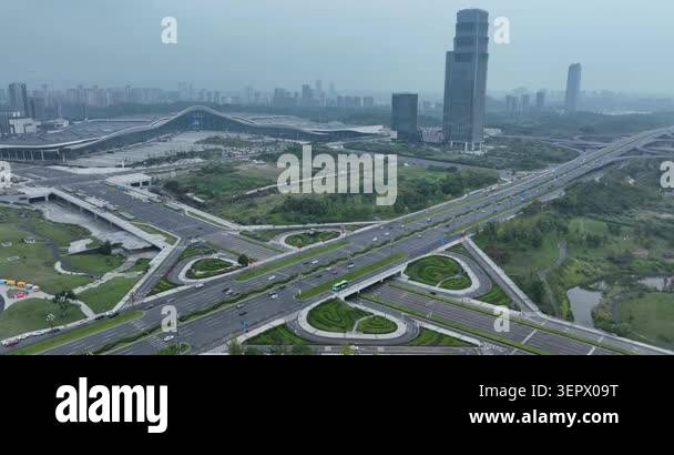Aerial view of a complex highway interchange with cars driving, leading ...