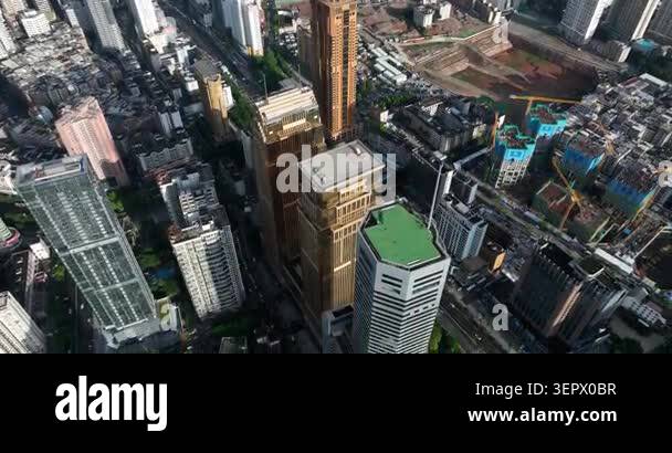 Aerial drone footage capturing a sprawling cityscape with towering ...