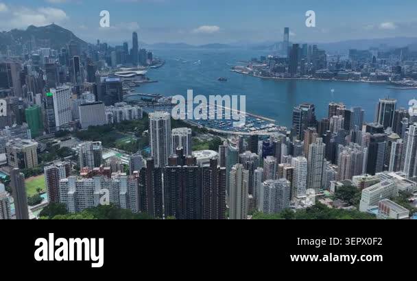 Aerial drone view of a sprawling cityscape with numerous skyscrapers ...