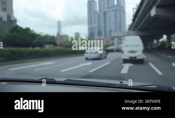 POV driving on a highway with traffic, passing under an overpass with ...