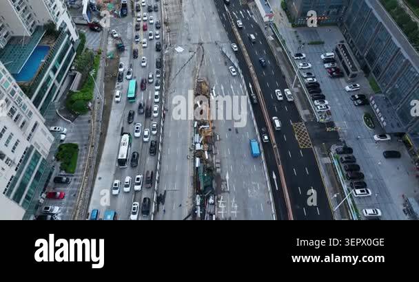 Aerial view of a busy highway with cars and buses moving in traffic ...