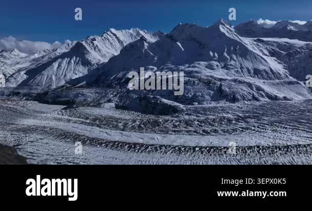 Beautiful high altitude hanging glacier and snow capped mountain with ...