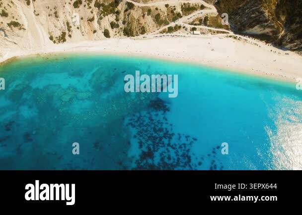 Turquoise shallow water and sandy shore at Myrtos Beach on Kefalonia ...