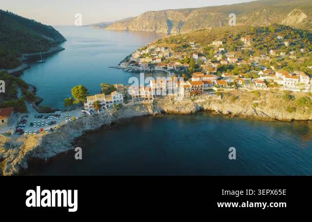 Picturesque coastal village with colorful houses and clear water bay ...