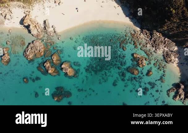 Secluded Coastal Paradise with Rocky Shoreline. High quality 4k footage ...