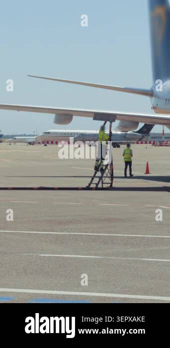 Aircraft wing near runway during jet fuel operations Stock Video ...