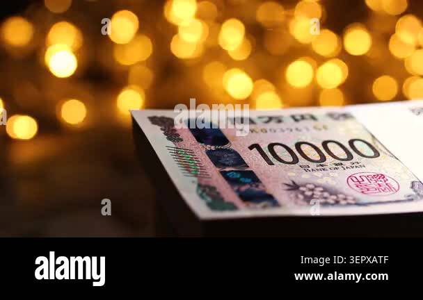 Japanese Yen Banknotes Stack Against a Flashing Illumination Background ...