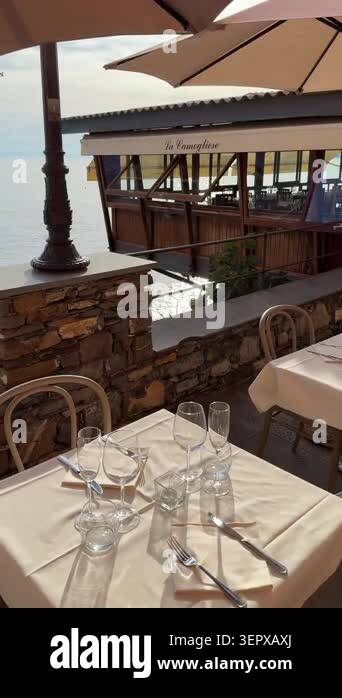Patrons dine at La Camogliese in Camogli, Italy. Tables are set with ...