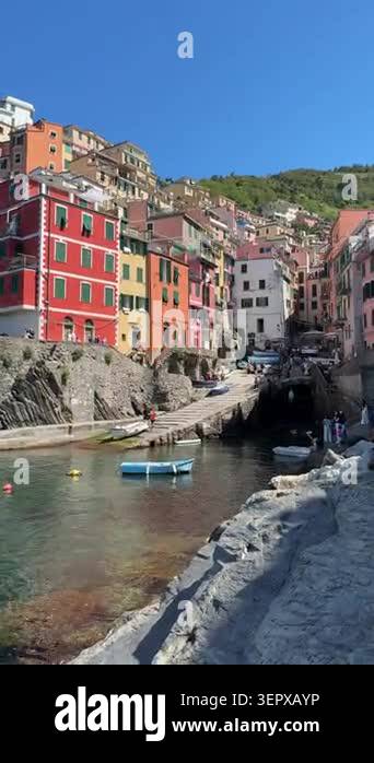 Riomaggore, a fishing village in Italy, where colorful buildings line ...