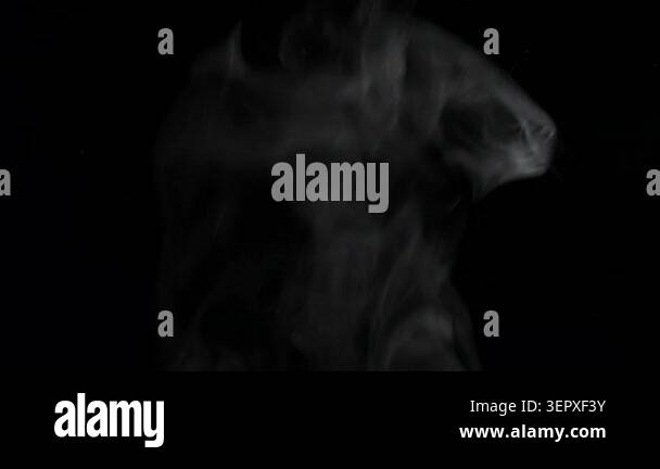 Natural steam movement captured over boiling water on a black ...