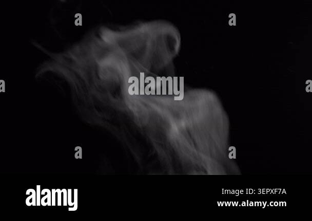 Natural steam movement captured over boiling water on a black ...
