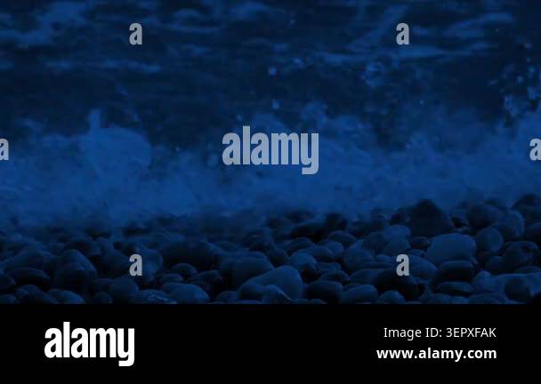 Waves Over Beach Pebbles At Night Stock Video Footage - Alamy