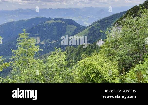 Static high angle landscape shot shows the Austrian Alps countryside in ...