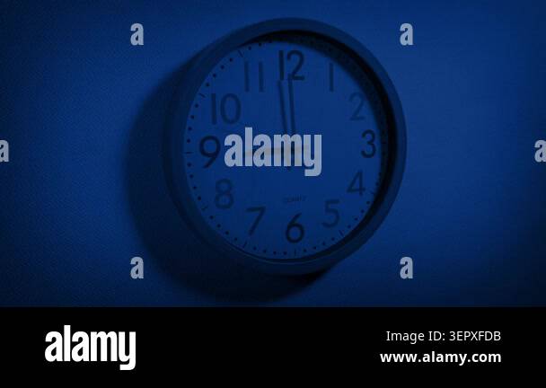 Clock At Nine In The Dark Stock Video Footage - Alamy