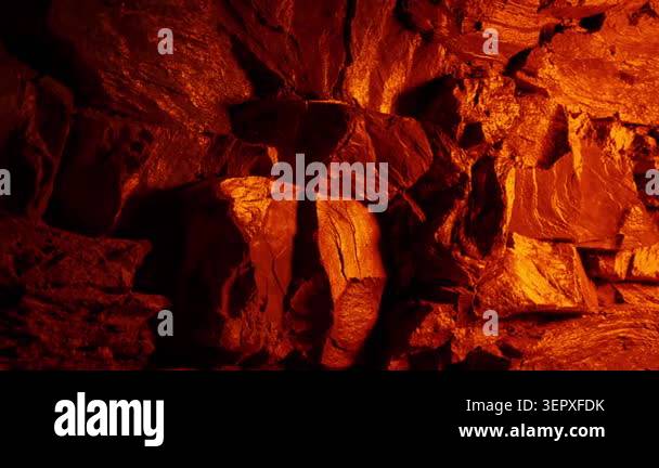Cave Wall In Fire Glow Moving Shot Stock Video Footage - Alamy
