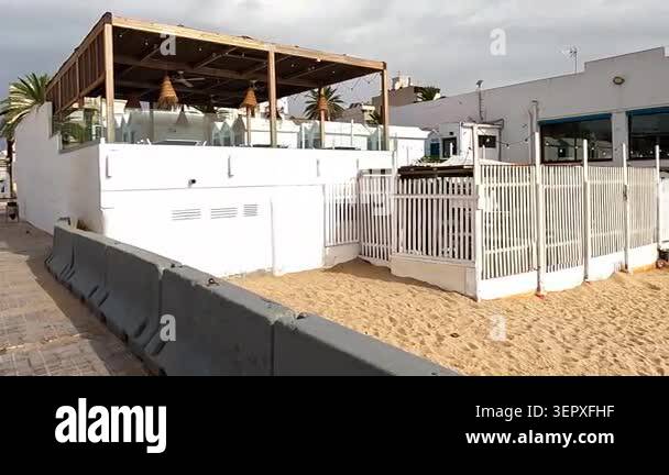 White modular beach club structure in Badalona, Spain, symbolizing ...