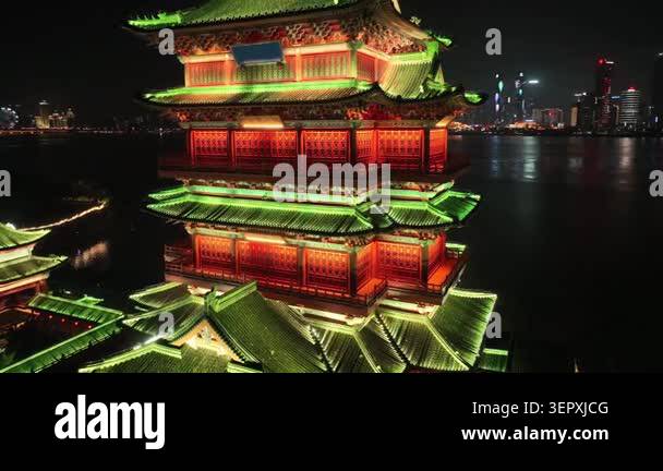 Aerial drone shot Tengwang Pavilion illuminating the night skyline of ...