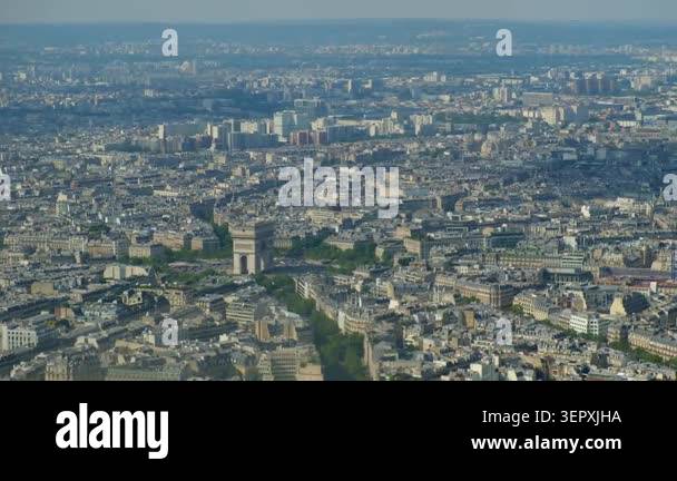 Aerial view of the Arc de Triomphe and the sprawling cityscape of Paris ...
