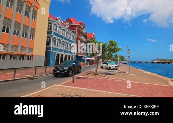 Beautiful view of colorful waterfront buildings along Curacao harbor on ...