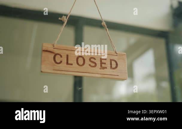 woman hand changing wooden sign closed to open status Stock Video ...