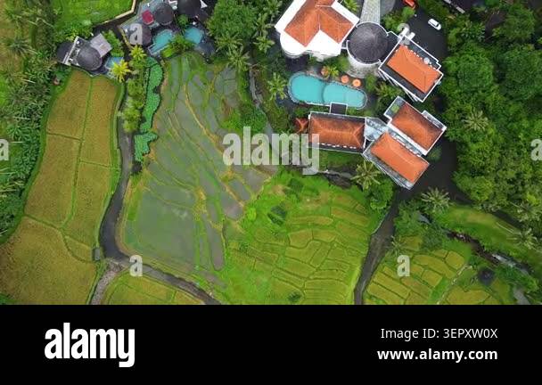 Aerial top down view of a luxury hotel with villas and swimming pools ...