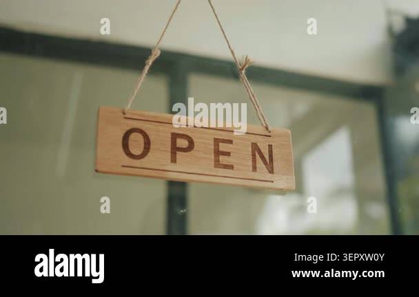 woman hand changing wooden sign closed to open status Stock Video ...