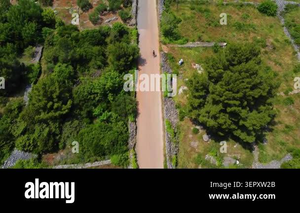 Top down aerial view of a cyclist riding through the stari grad plain ...