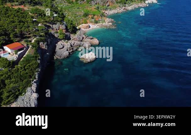 Stunning aerial footage revealing the rocky cliffs and turquoise ...