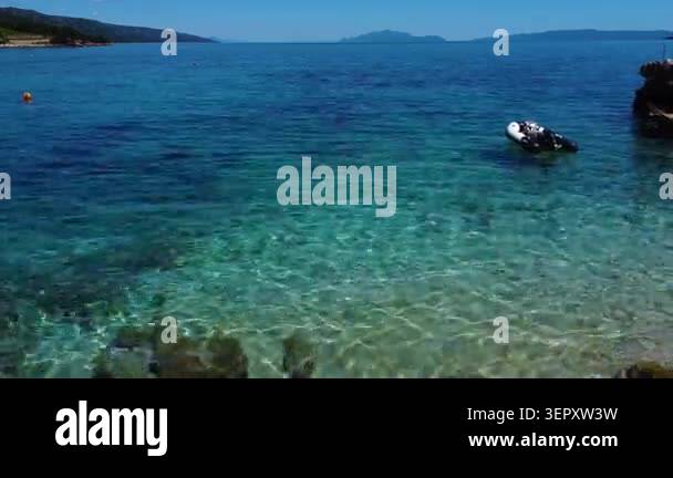Beautiful clear turquoise water of the adriatic sea gently rippling at ...