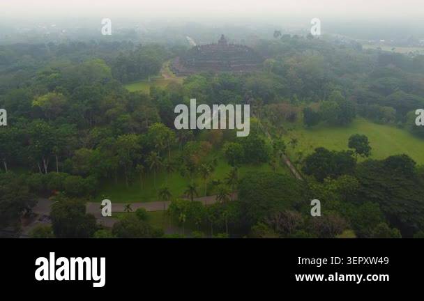 Majestic aerial footage approaching the ancient borobudur temple in ...