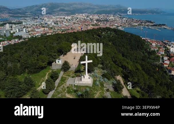 Panoramic aerial view of telegrin peak with its large cross in marjan ...