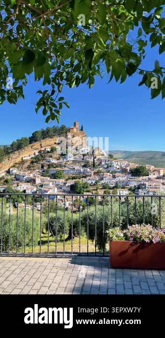 Vertical video showing a picturesque village with white houses cascades ...