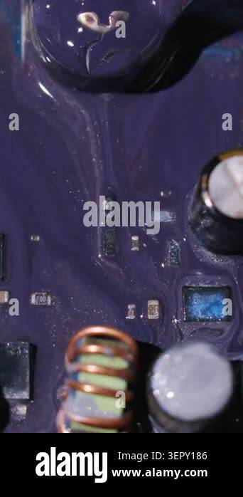 Vertical video. Paint pour. Digital hardware. Defocused purple blue ...
