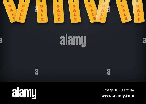 A row of bright yellow sale tags hanging against a dark black ...