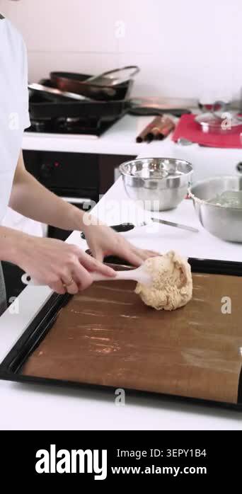 Vertical video. Pastry cooking. Confectionery work. Female baker hand ...