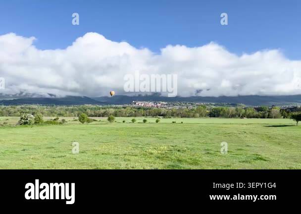Stunning panoramic view of a hot air balloon flying over the Catalan ...