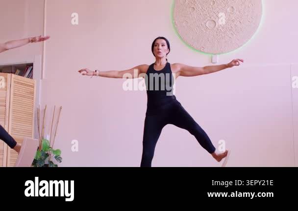 Healthy workout. Balance board. Barefoot woman rocking on wooden ...
